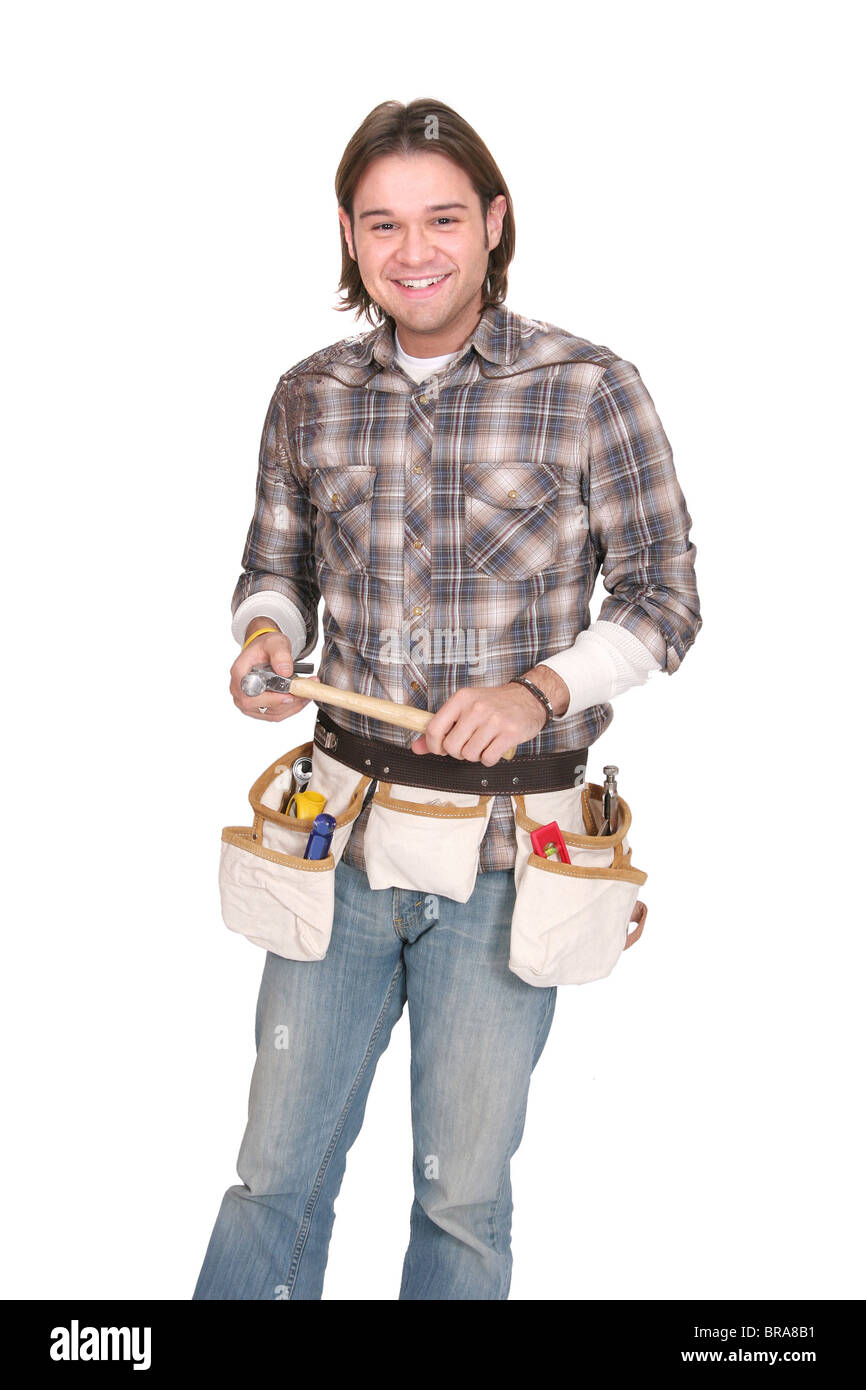 one twenties young man working construction labor with tools over white ...