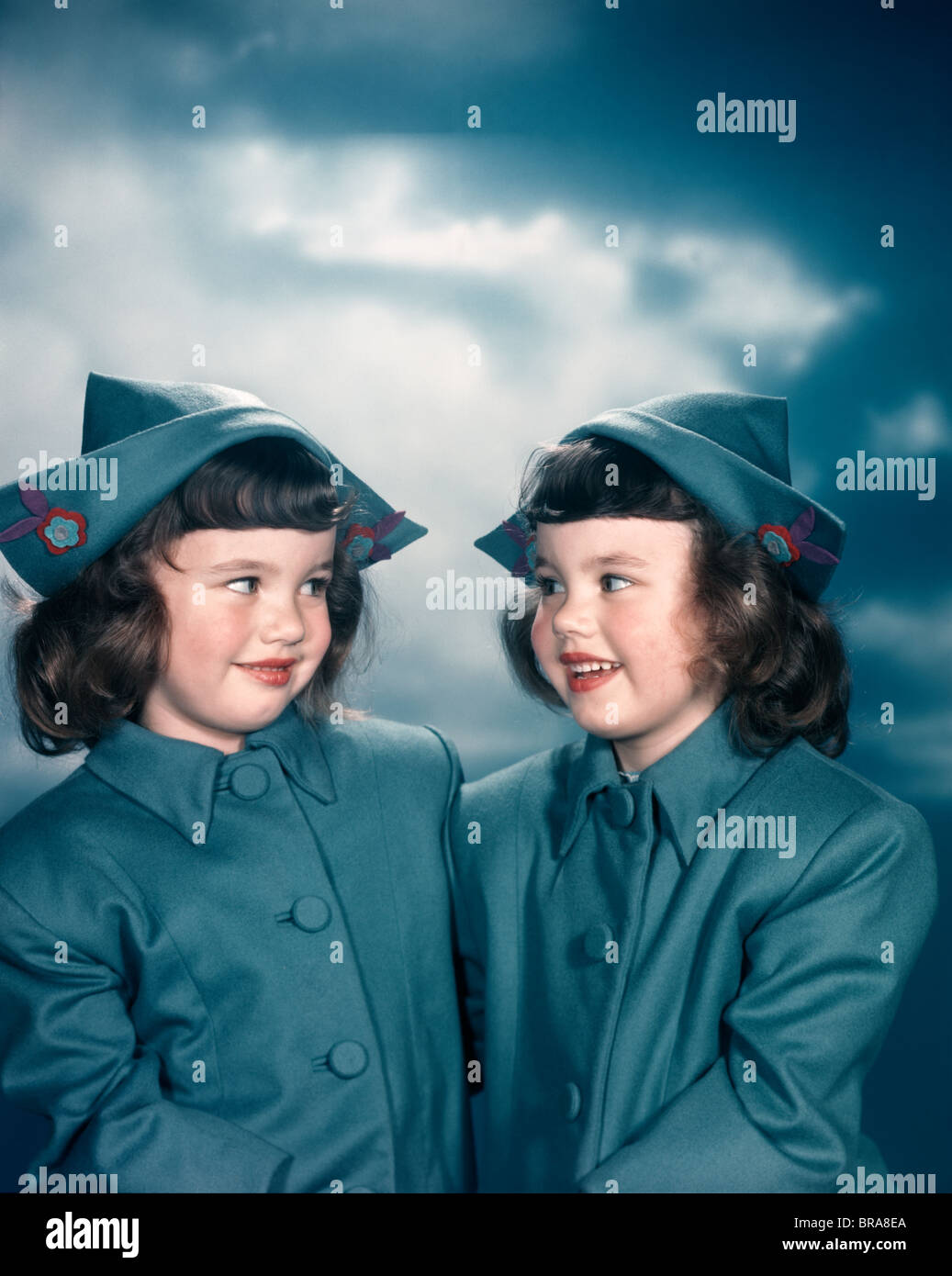 1940s 1950s PORTRAIT TWIN GIRLS WEARING BLUE DUTCH OUTFITS OVERCOATS ...