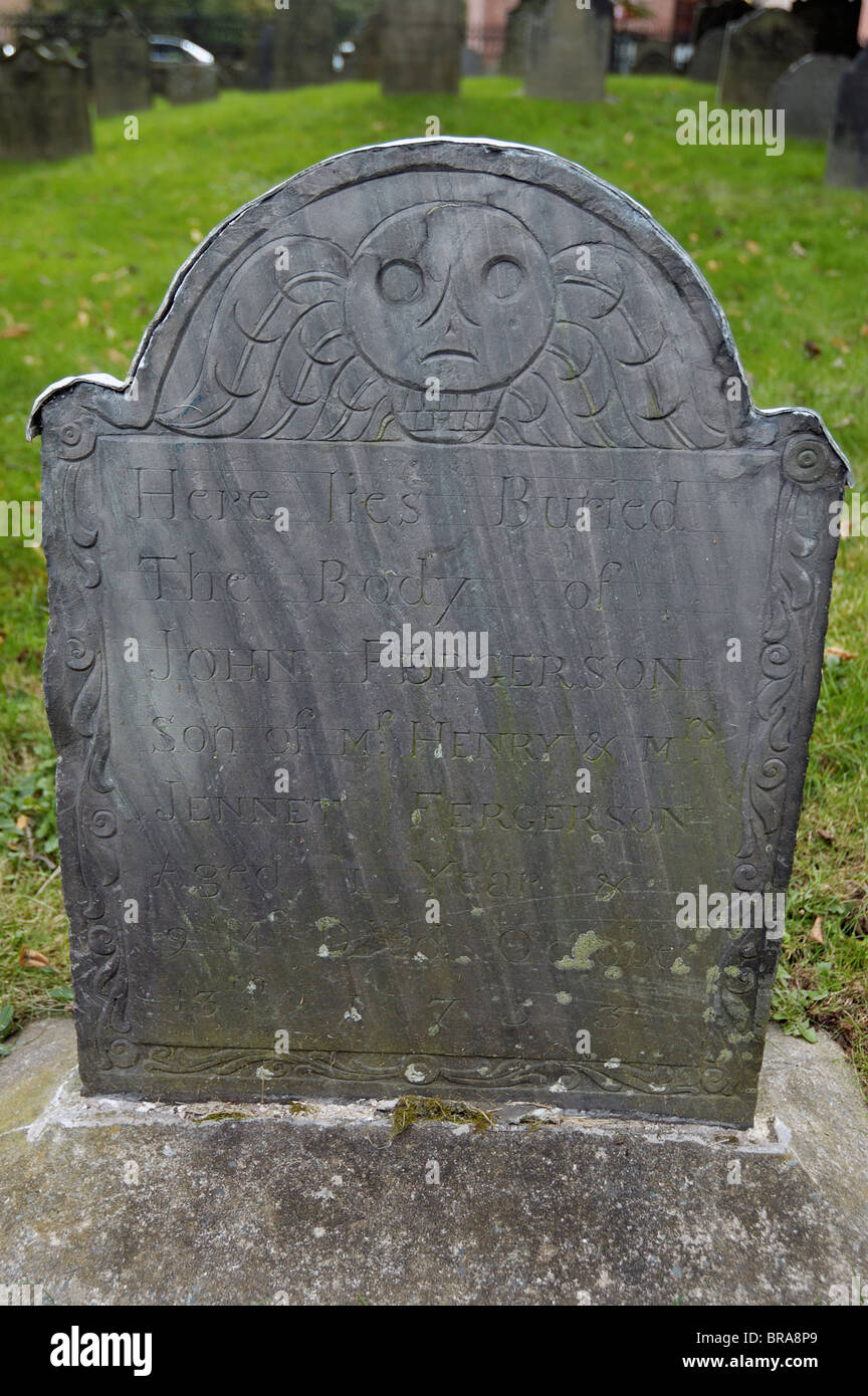 An old gravestone showing the deaths head Stock Photo - Alamy