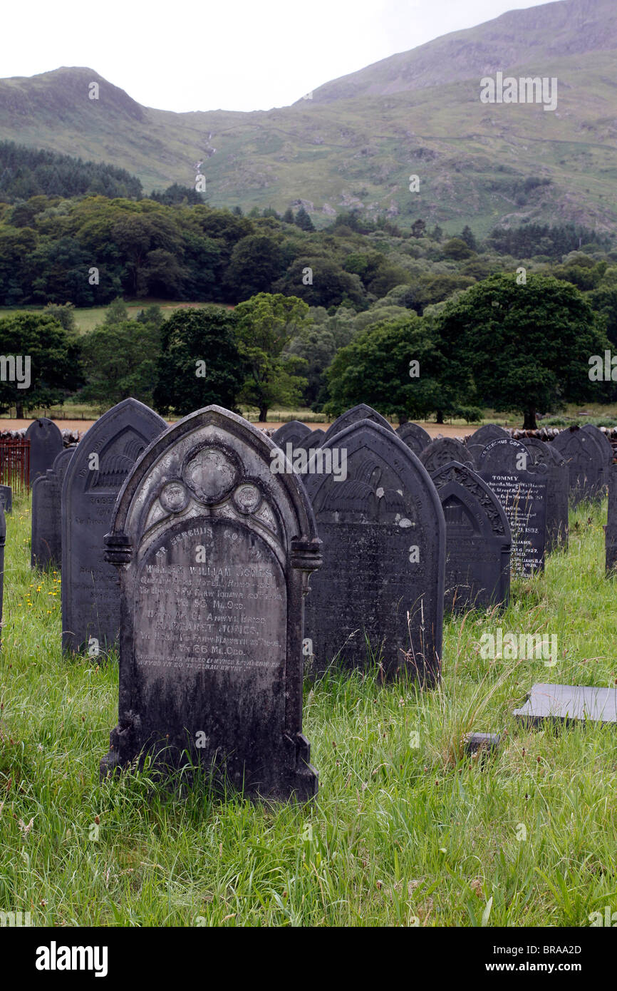 Slate gravestones in Beddgelert graveyard, looking into the hills ...