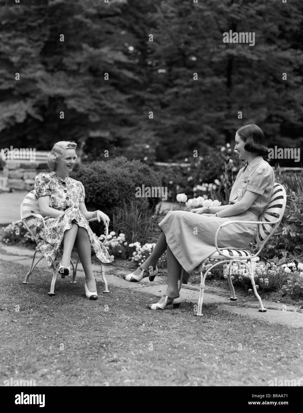 1940s TWO WOMEN SITTING IN IRON LAWN CHAIRS TALKING SMILING BACKYARD ...