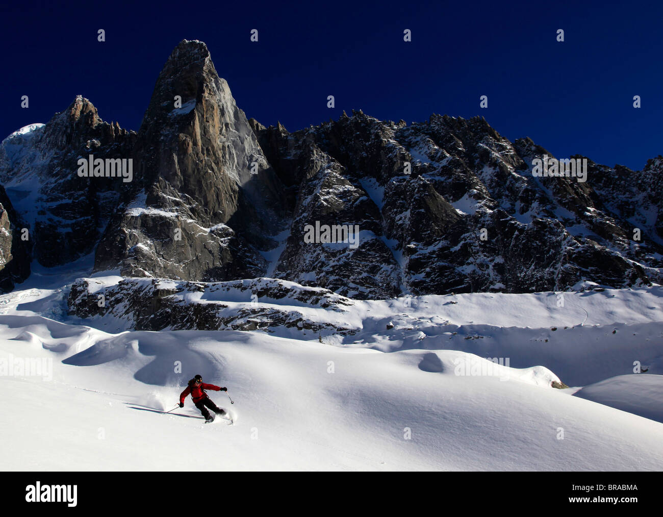 A skier enjoying perfect powder snow on the celebrated Pas de Chevre ...