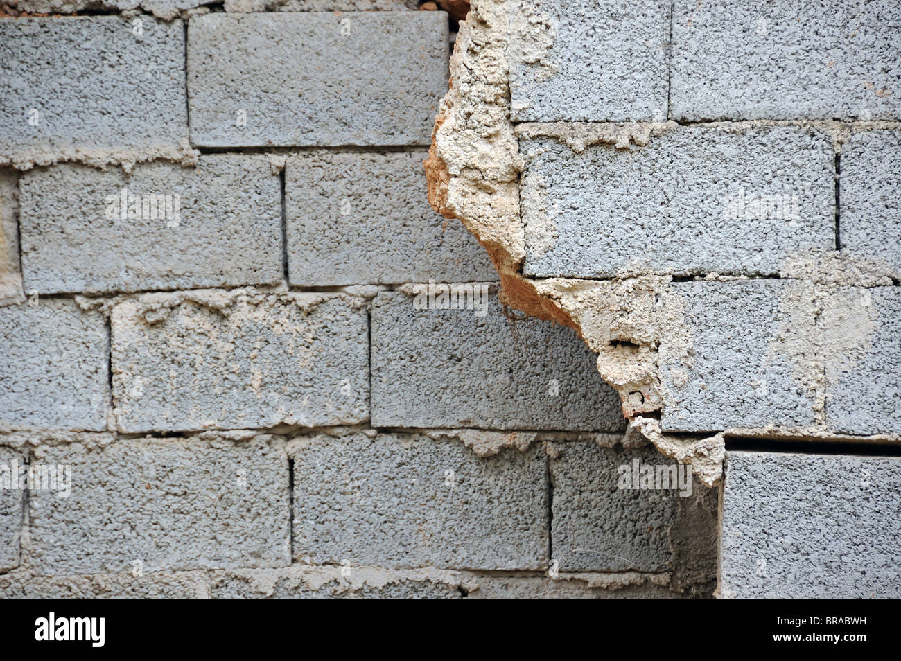 Broken cinder block brick wall background texture Stock Photo - Alamy