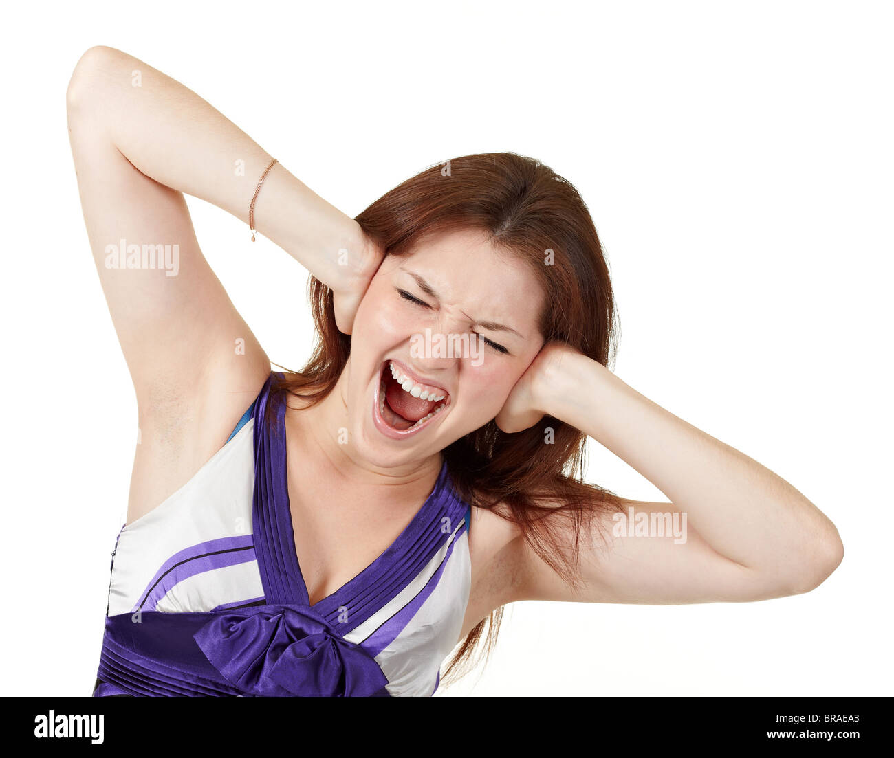 young screaming girl holding her head Stock Photo - Alamy