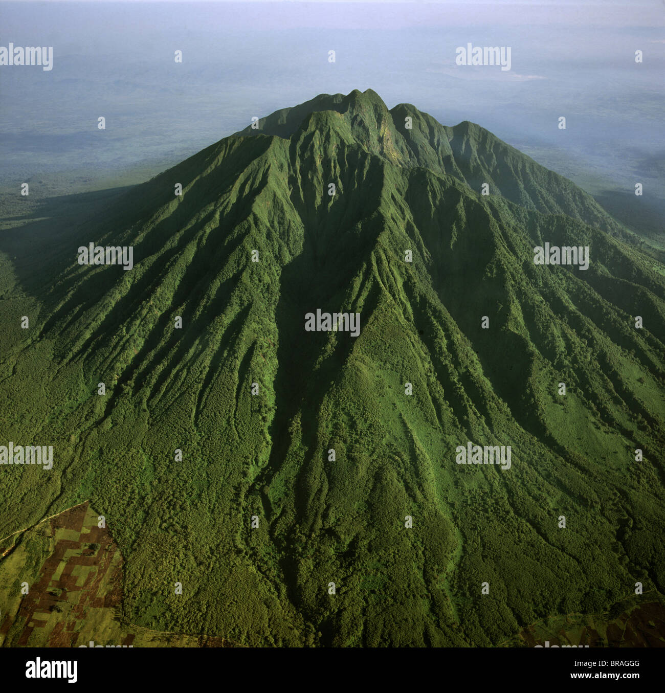 Aerial view of Mount Sabyinyo, an extinct volcano and oldest of the ...
