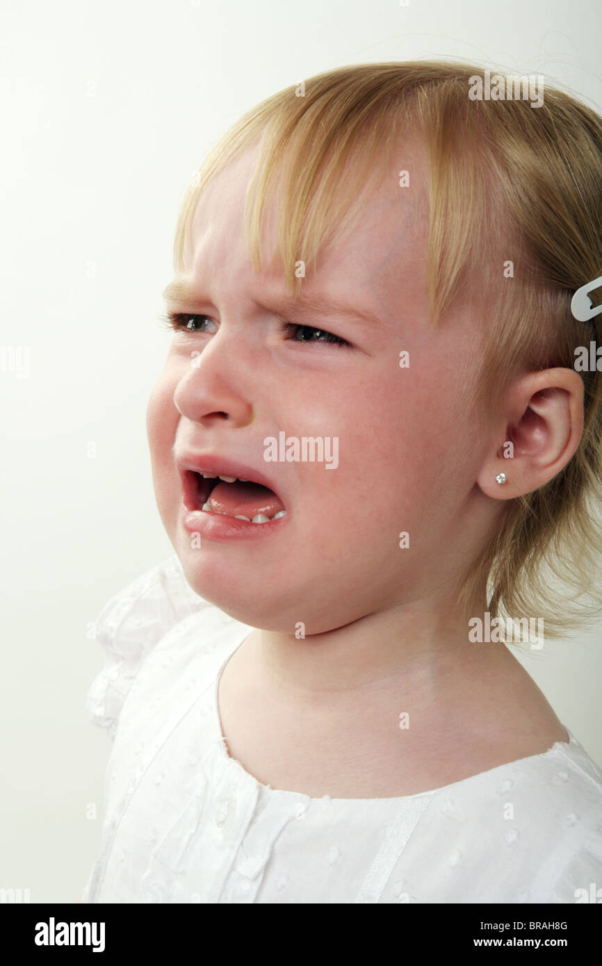 Two year old girl crying Stock Photo - Alamy