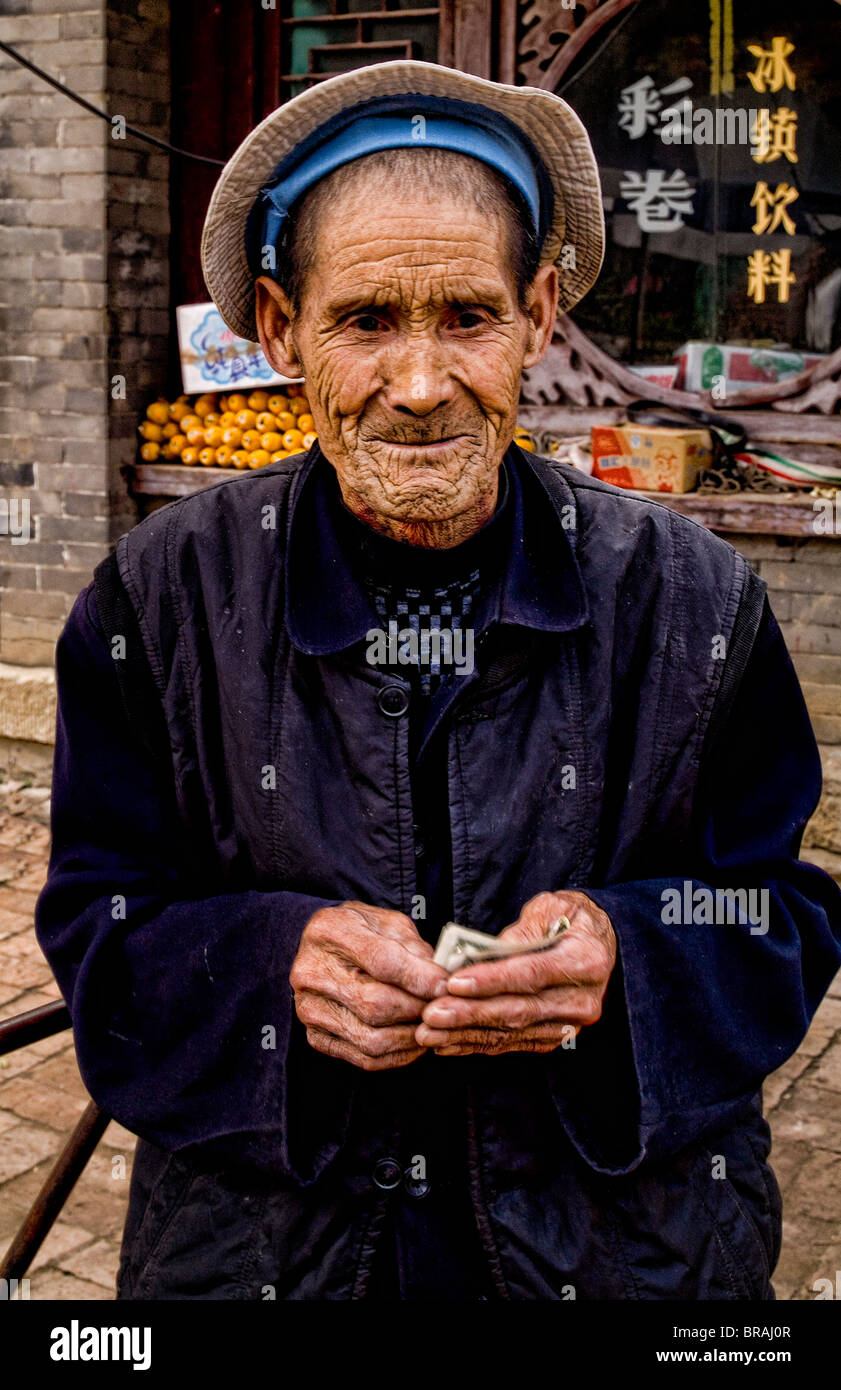 China Beijing Local old man in park with old traditional dress in ...