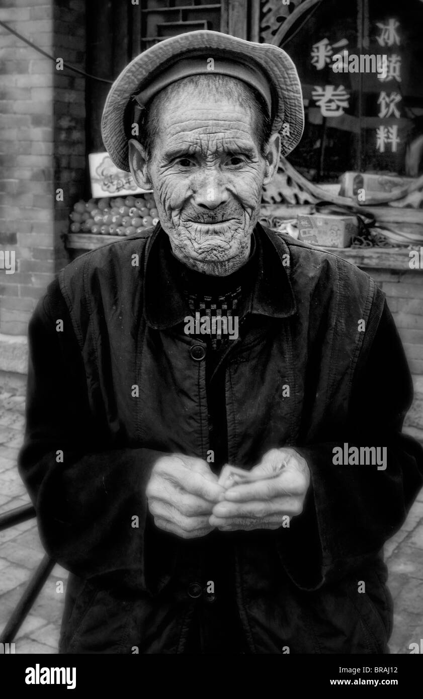 China Beijing Local old man in park with old traditional dress in ...