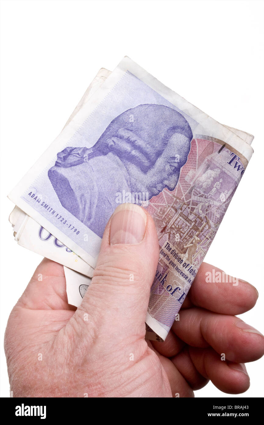Hand holding sterling cash notes Stock Photo - Alamy