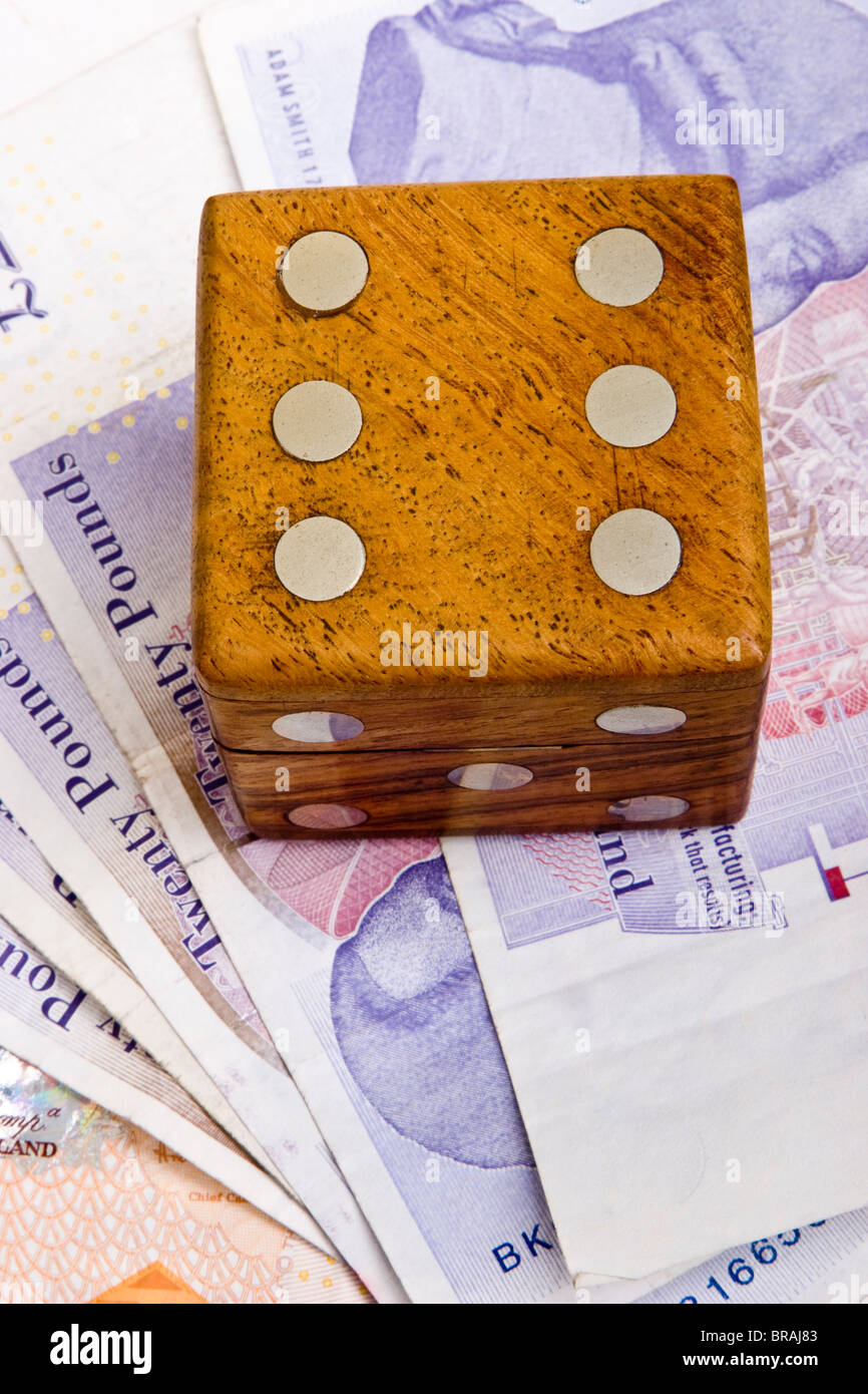 Wooden Die Or Dice With British Sterling Pound Notes Stock Photo Alamy wooden-die-or-dice-with-british-sterling-pound-notes-stock-photo-alamy