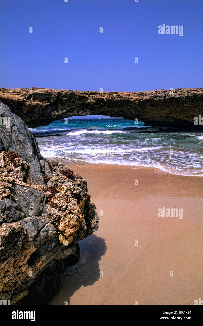 Beach and Rocks of the famous Natural Bridge colorful vacation in Aruba ...