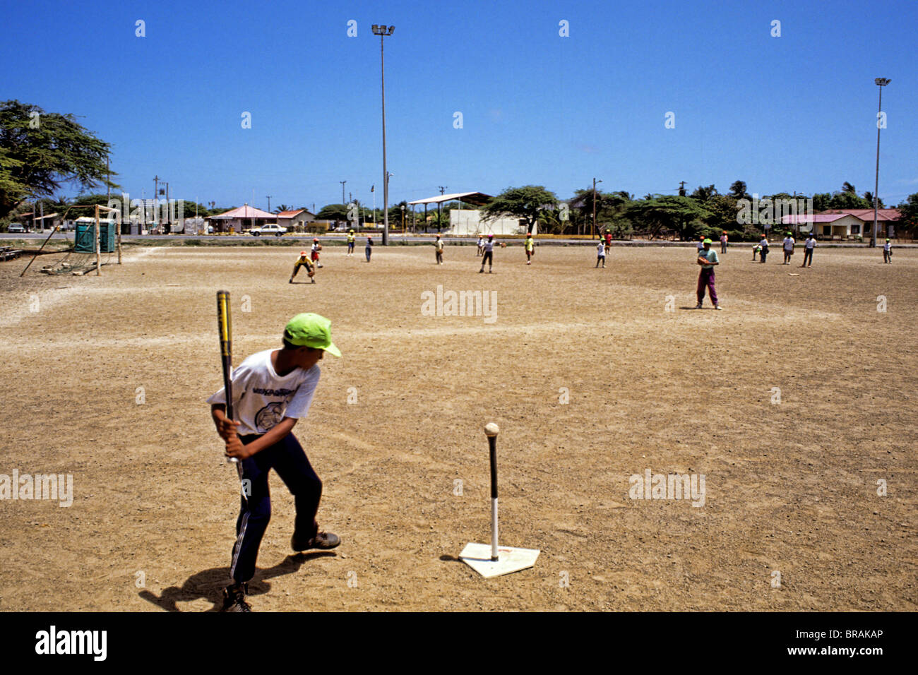 Passion of baseball crazy teens practicing hitting in Curacao Caribbean ...