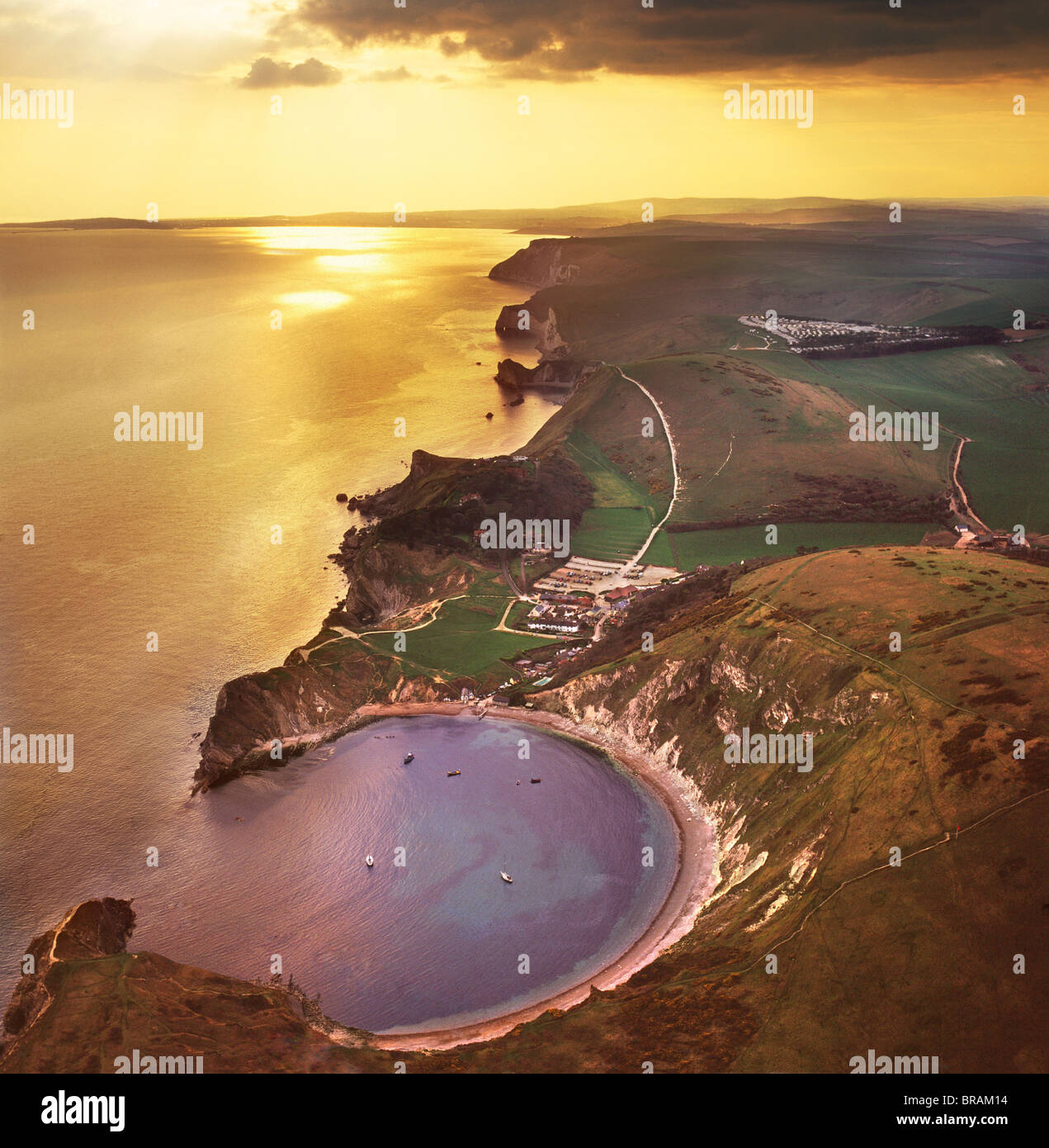 Aerial image of Lulworth Cove, a natural landform harbour, near West ...