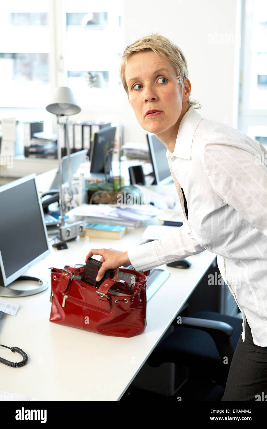 Woman stealing in the office Stock Photo, Royalty Free Image: 31583218 ...