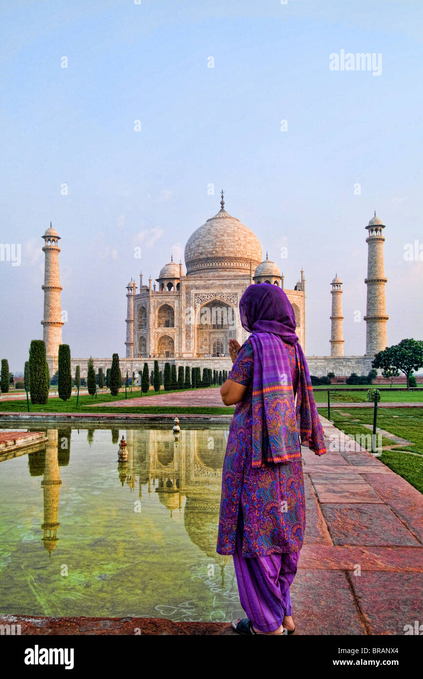 Hindu woman with colorful sari veil in the quiet peaceful Taj Mahal one ...