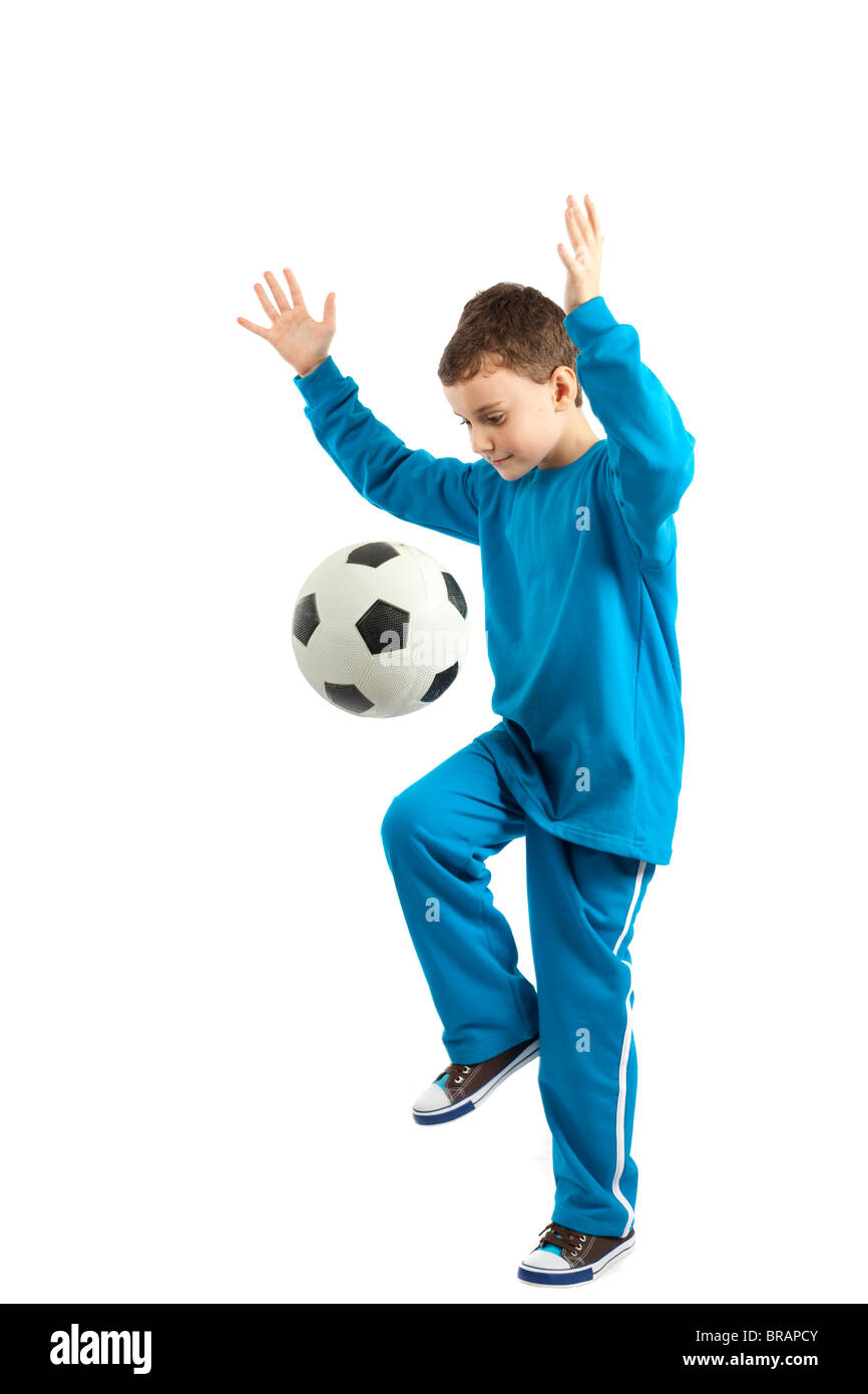 Adorable football kid executing a kick, isolated on white background ...