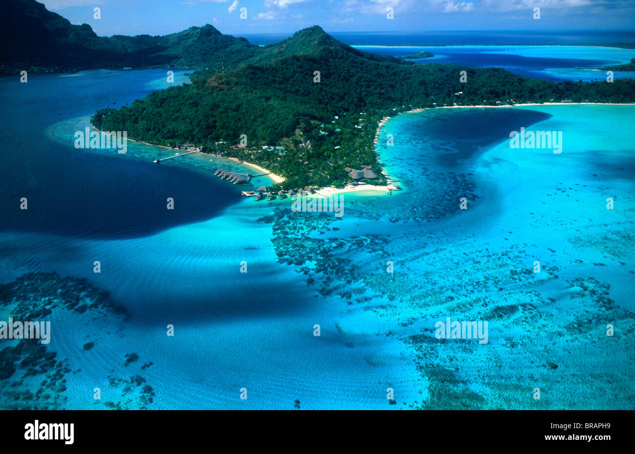 Aerial of the green water and clear blue colors of the islands of Bora ...