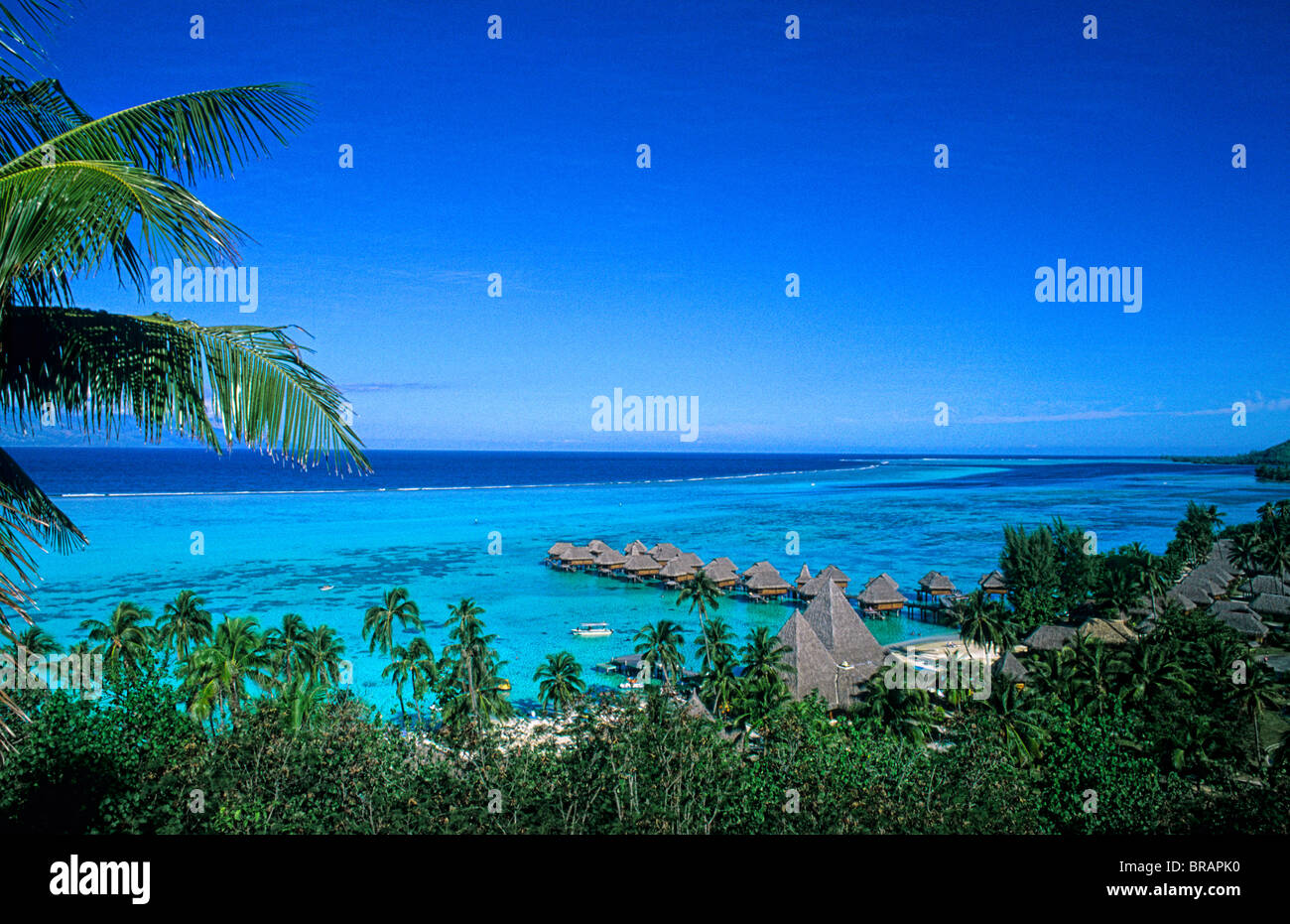 Ocean and huts over water in beautiful Tahiti in Bora Bora French ...
