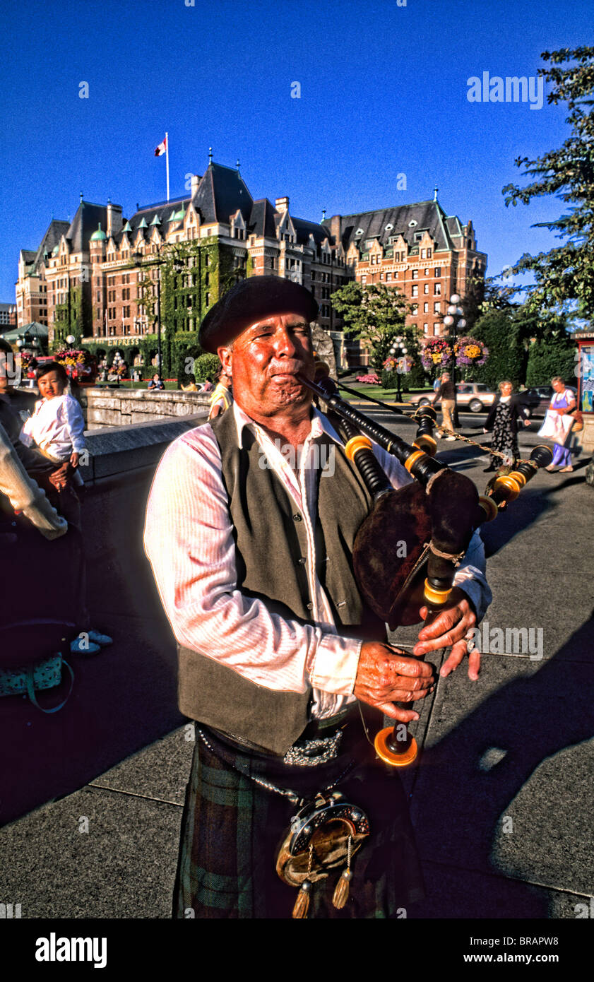 Local Scotish bag pipe player in front of the famous Empress Hotel in ...