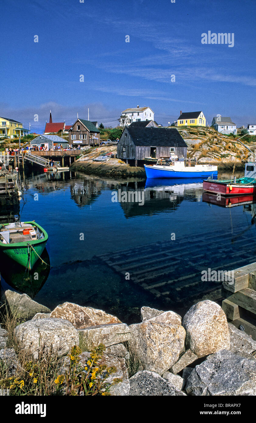 Beautiful village of Peggy's Cove with harbour and fishing sheds in ...