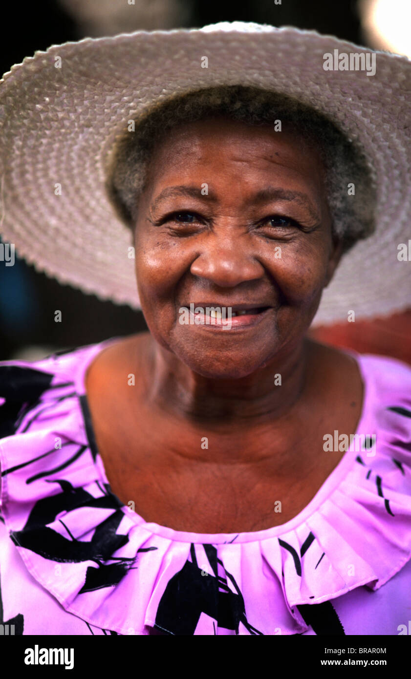 Colorful local woman in hat smiling portrait in the beautiful village ...
