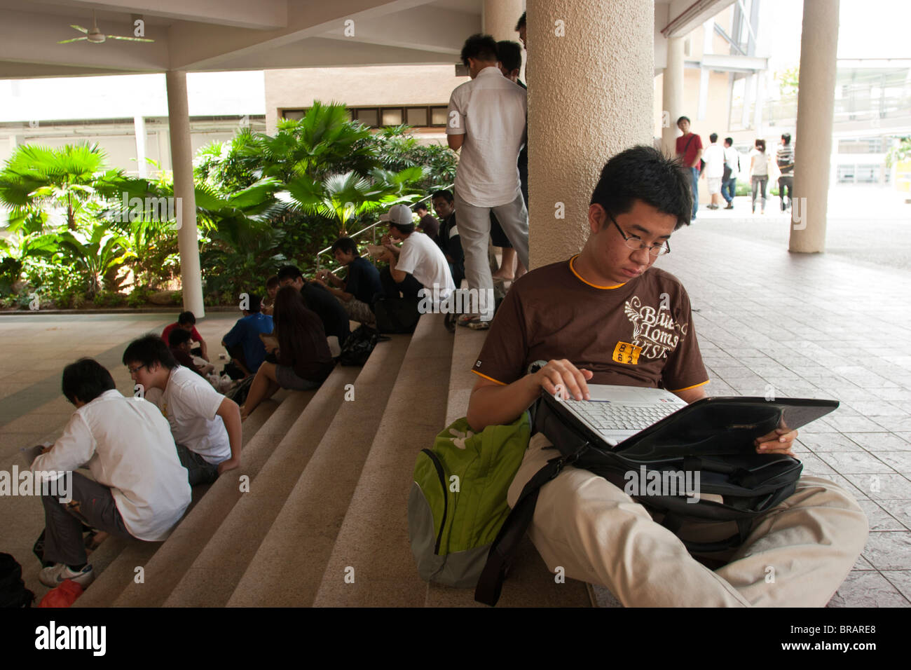A student works on his laptop at the Singapore Polytechnic in Singapore ...