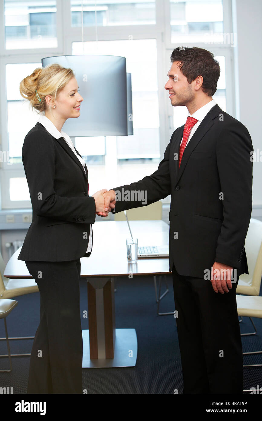 Man woman shake hands reception hi-res stock photography and images - Alamy