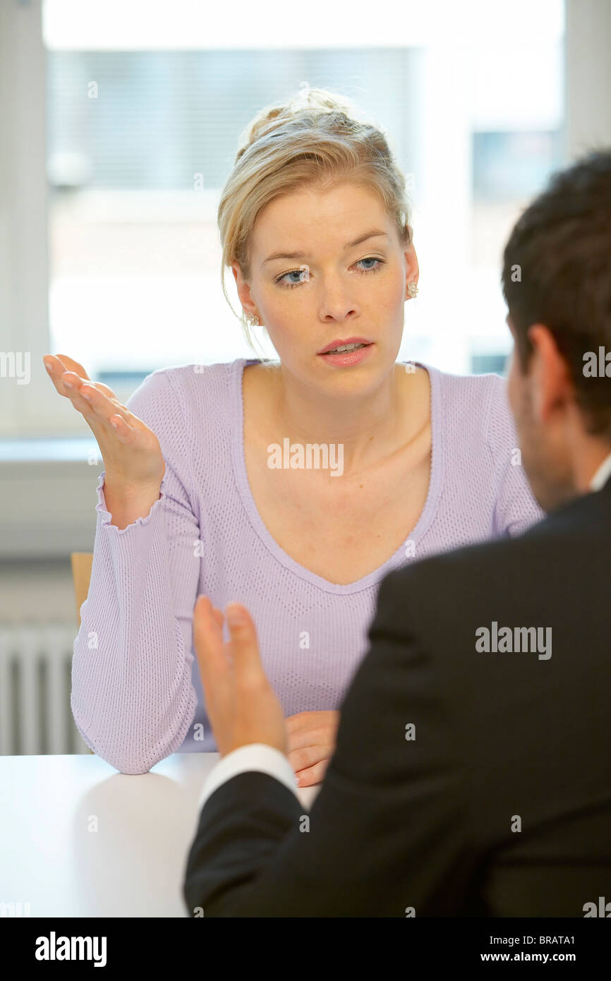 Young woman debating with her boss Stock Photo - Alamy