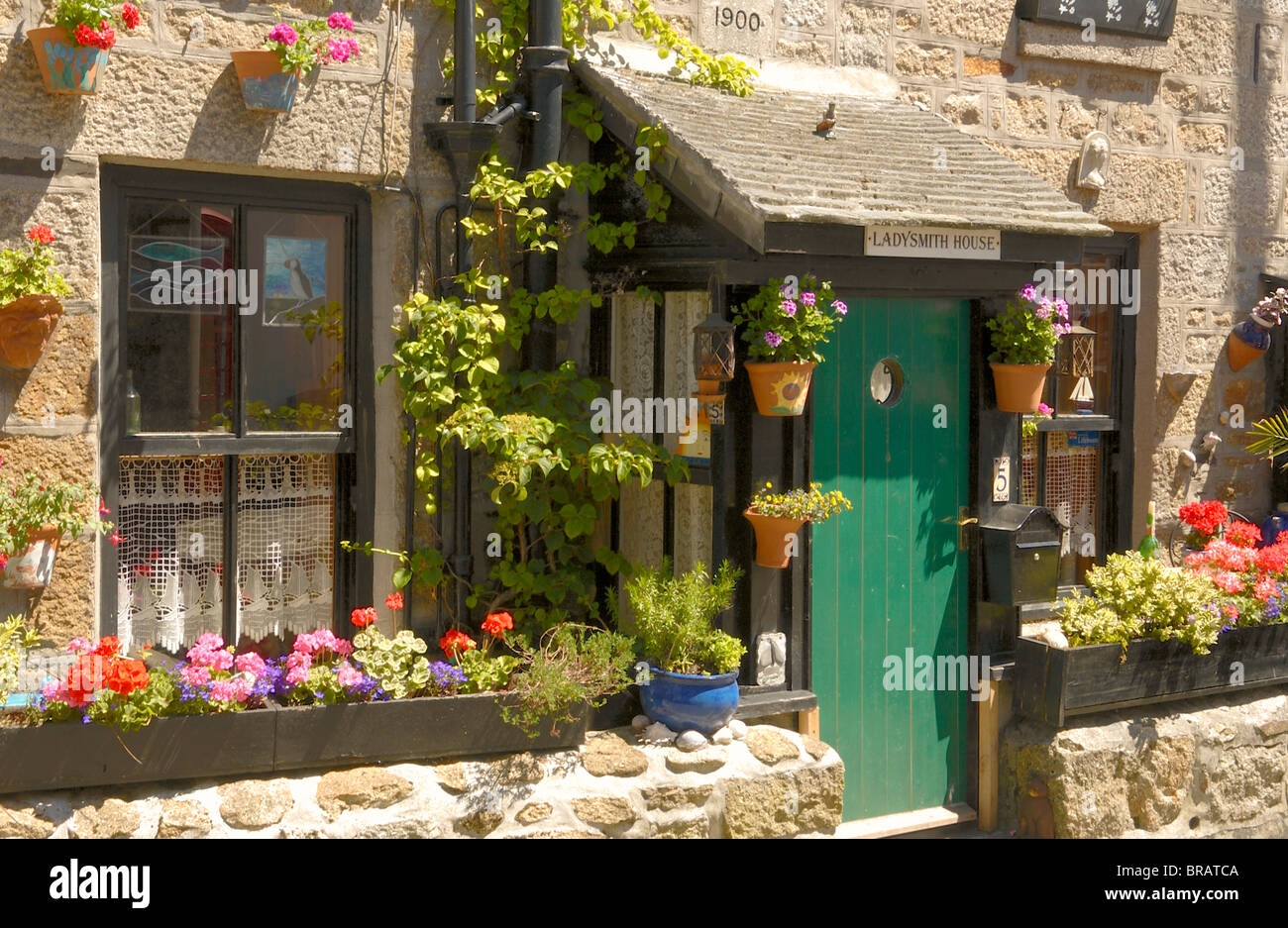 A decorated late Victorian stone cottage at Mousehole village in ...