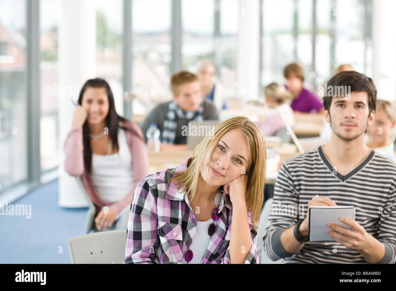 Class at high school - students in classroom writing notes during ...