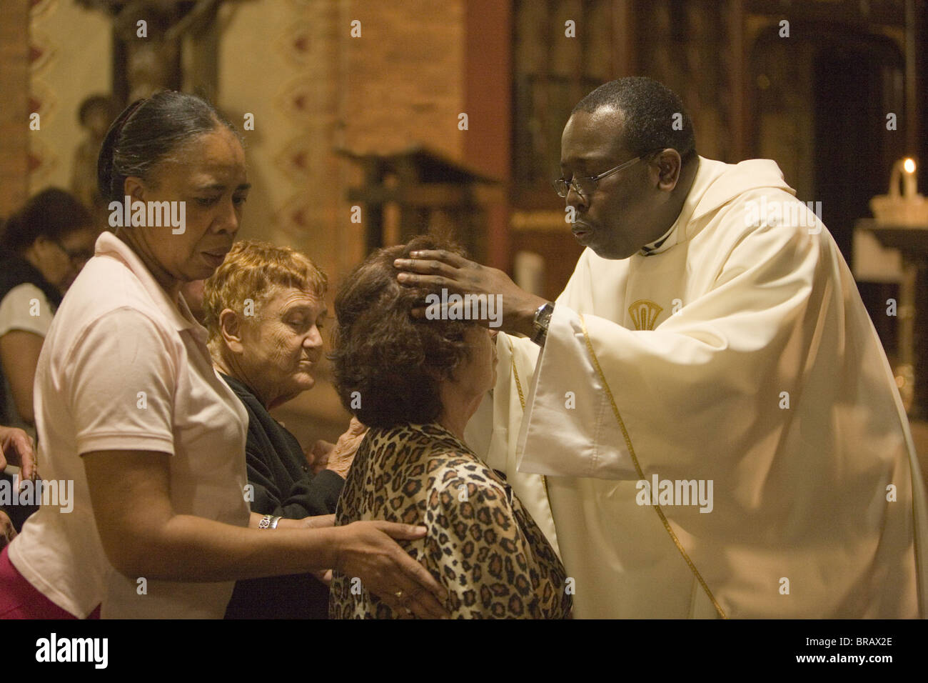 Priest conducts a healing Mass at a Catholic Church in Brooklyn, New ...