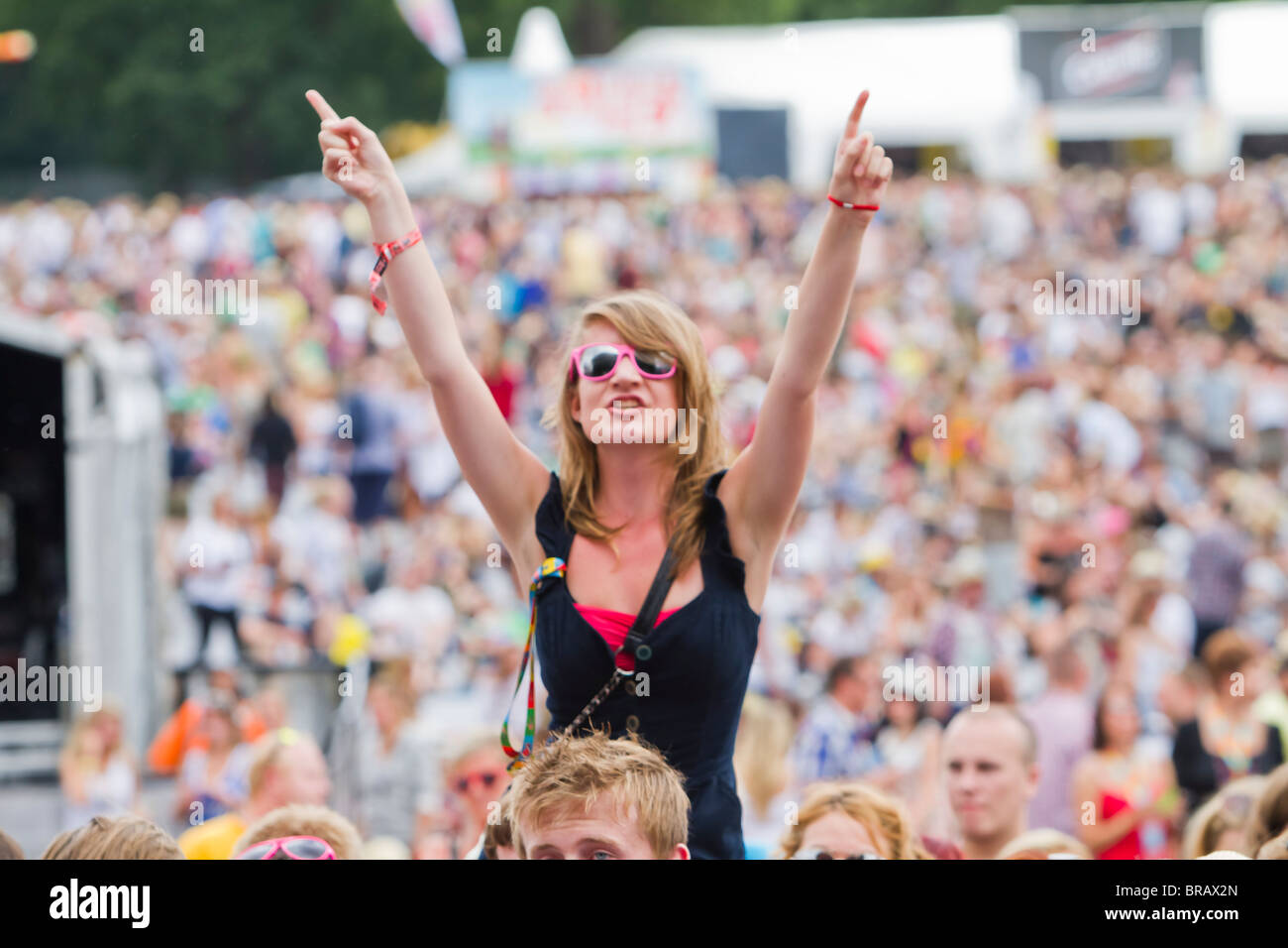Girl in Festival Crowd Stock Photo - Alamy