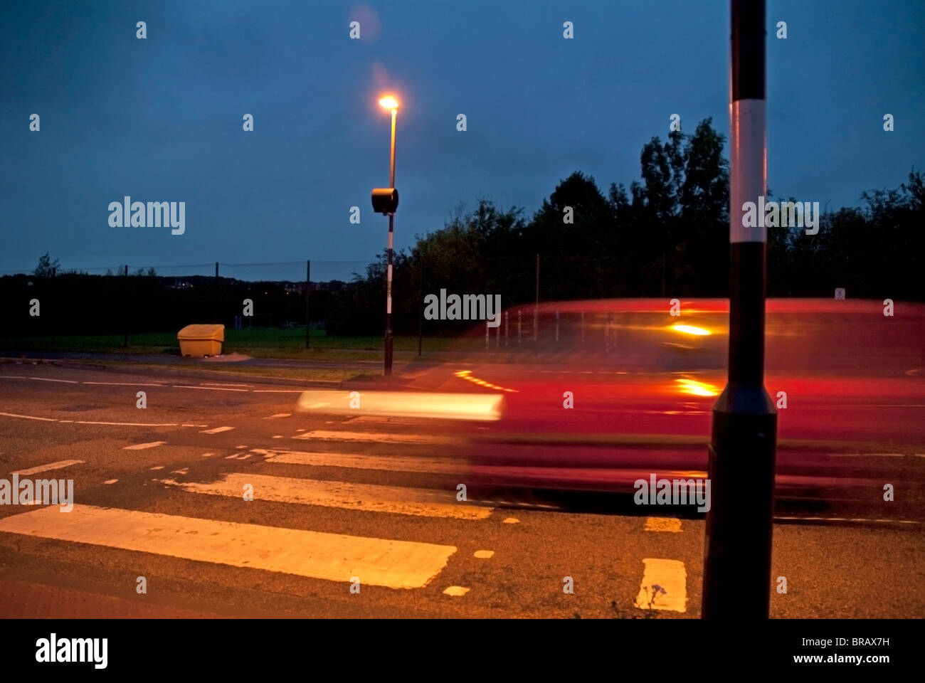 Zebra Crossing and Speeding Car at Night Stock Photo - Alamy