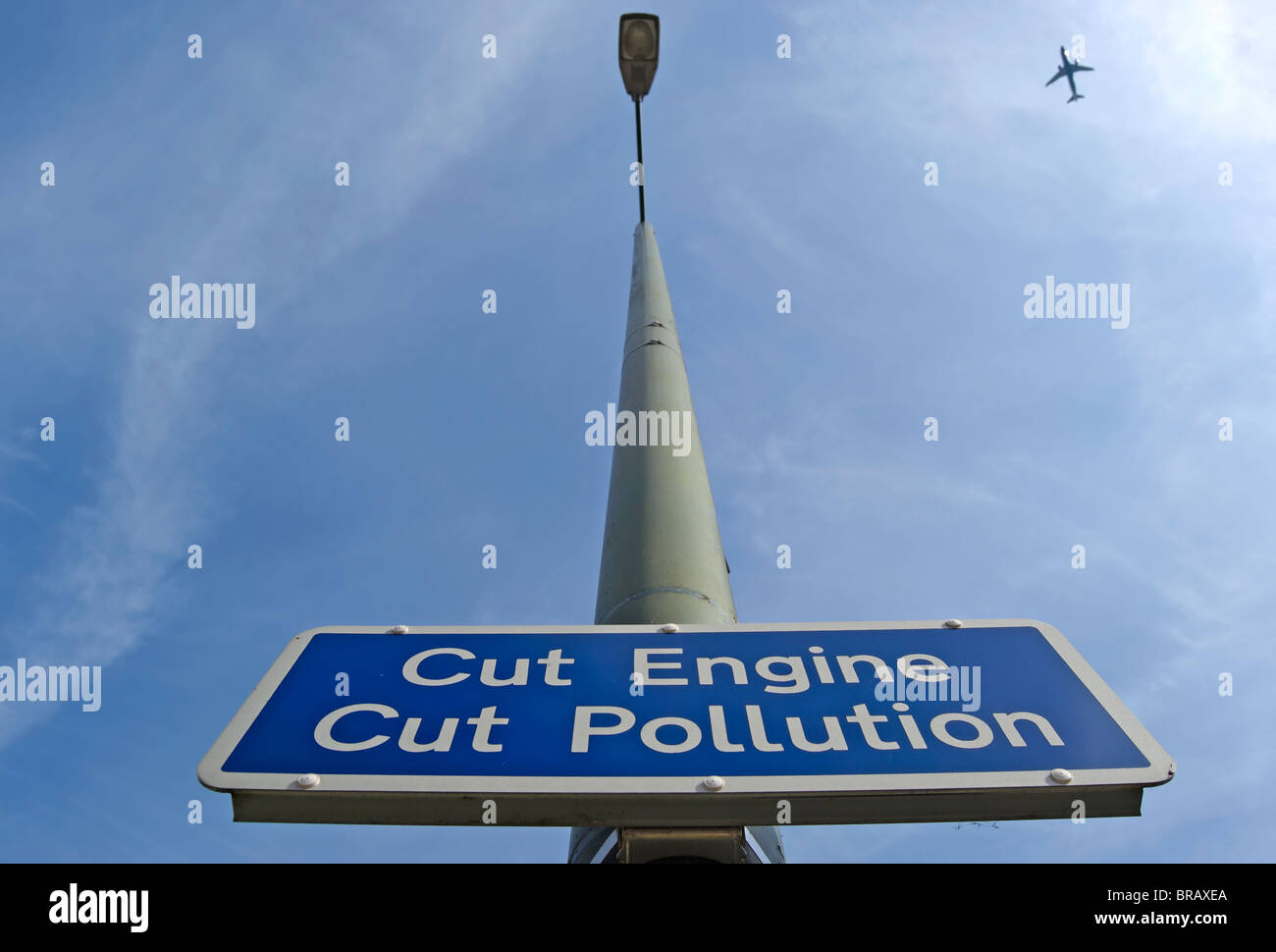 cut engine cut pollution sign adjacent to a railway level crossing in ...