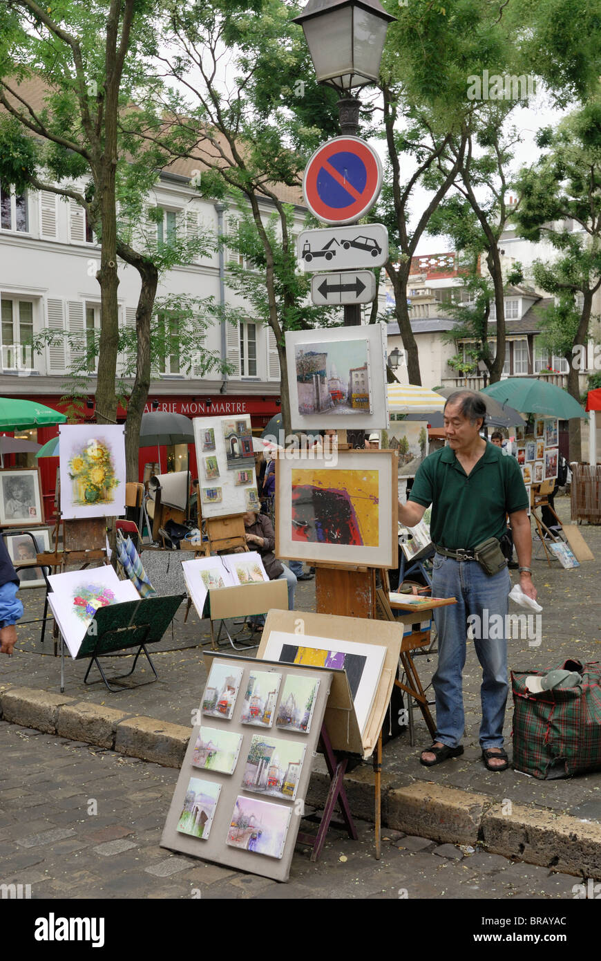 French Artist painting in the popular and art market located in the ...