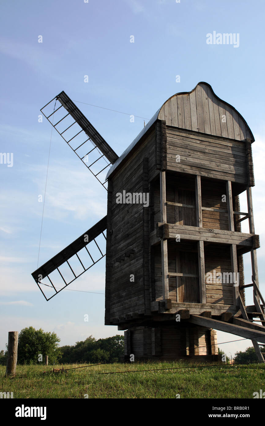 An old traditional windmill with wooden sails Stock Photo - Alamy