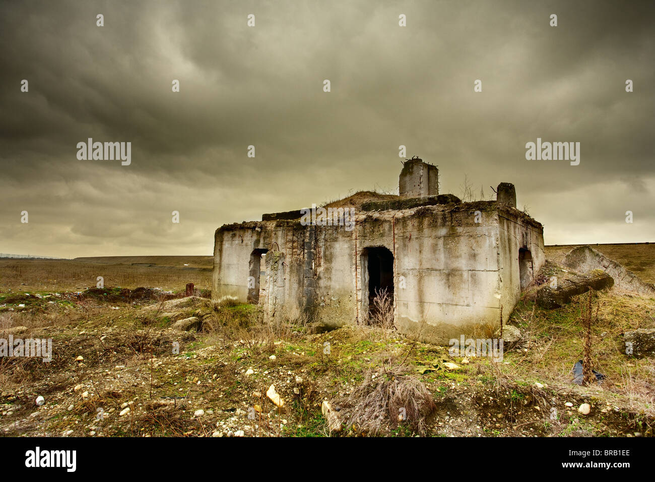Landscape with a decrepit ruin of a building under moody sky Stock ...