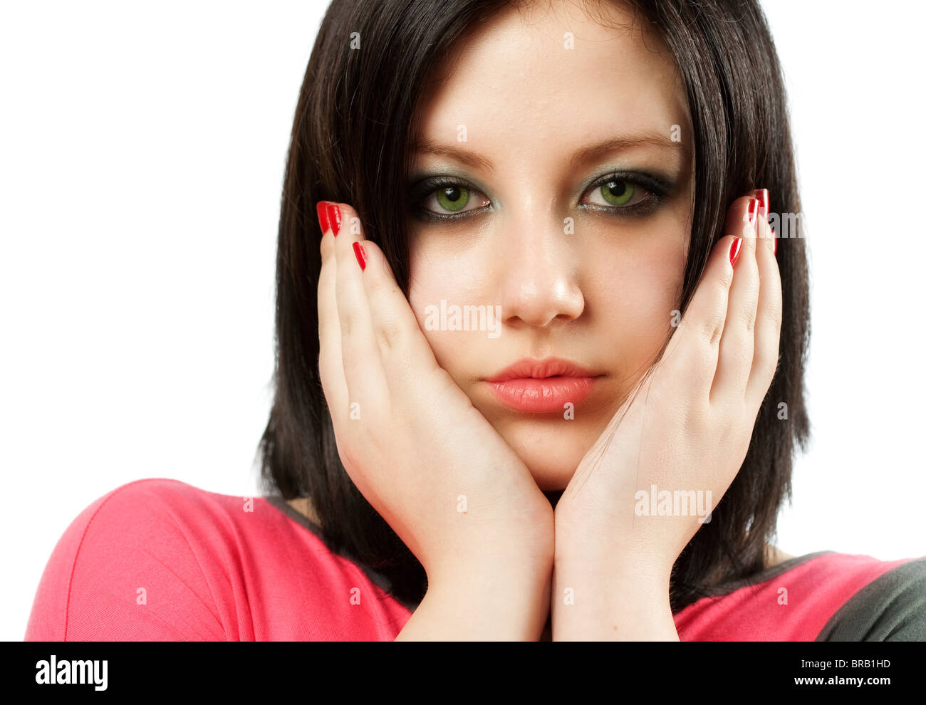 Close up portrait of a brunette framing her face with her hands Stock ...