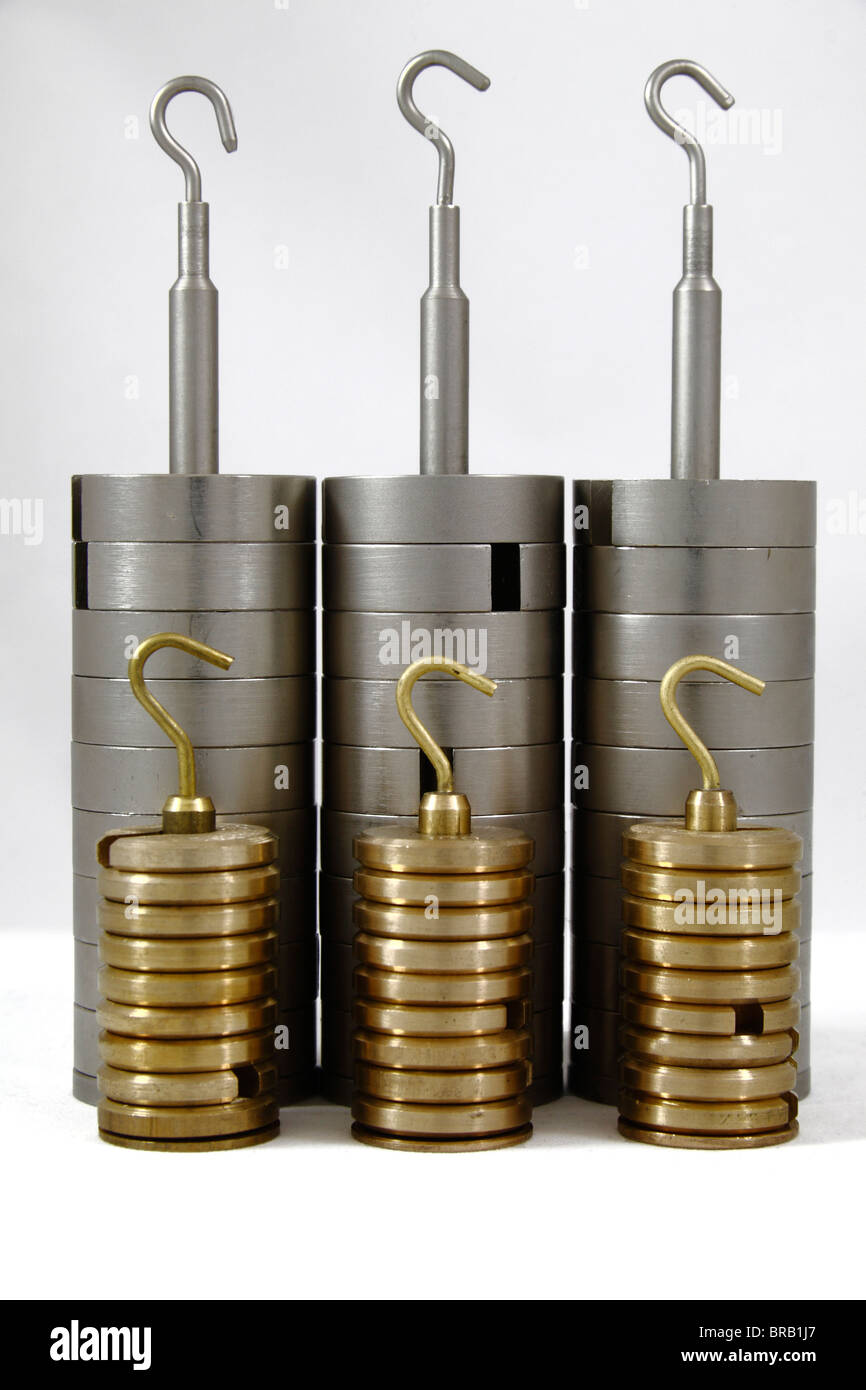 A series of school used masses on hooked cradles (silver 50g and brass ...