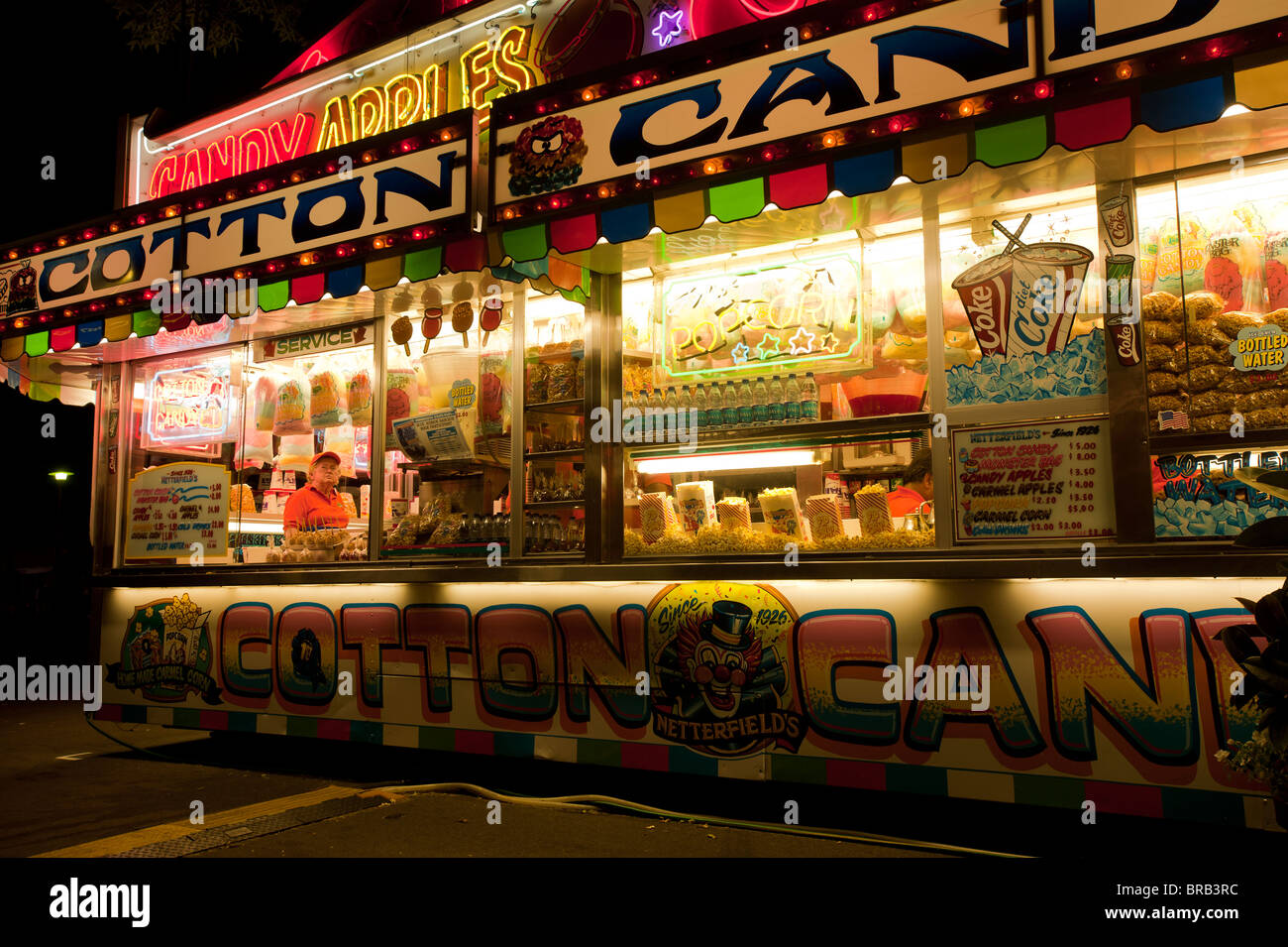 A WOMAN WORKING THE COTTON CANDY STAND AT THE MINNESOTA STATE FAIR ...