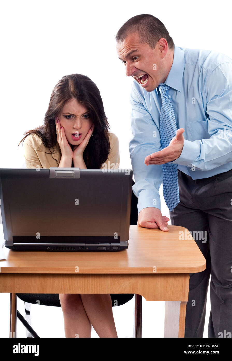Boss blaming an employee for bad results, studio shot Stock Photo - Alamy