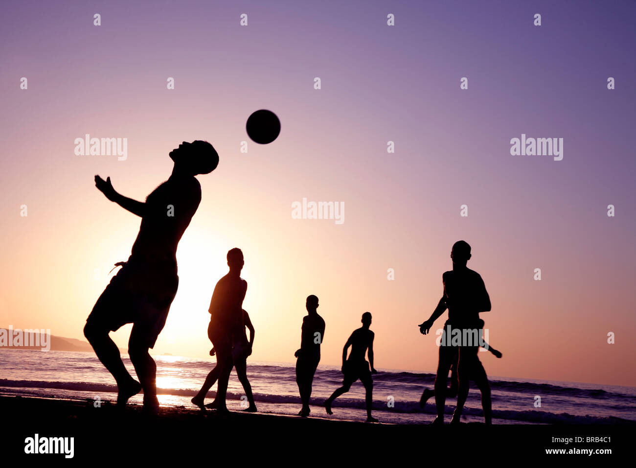 A game of football on the beach at sunset. Las Canteras Beach on Gran ...