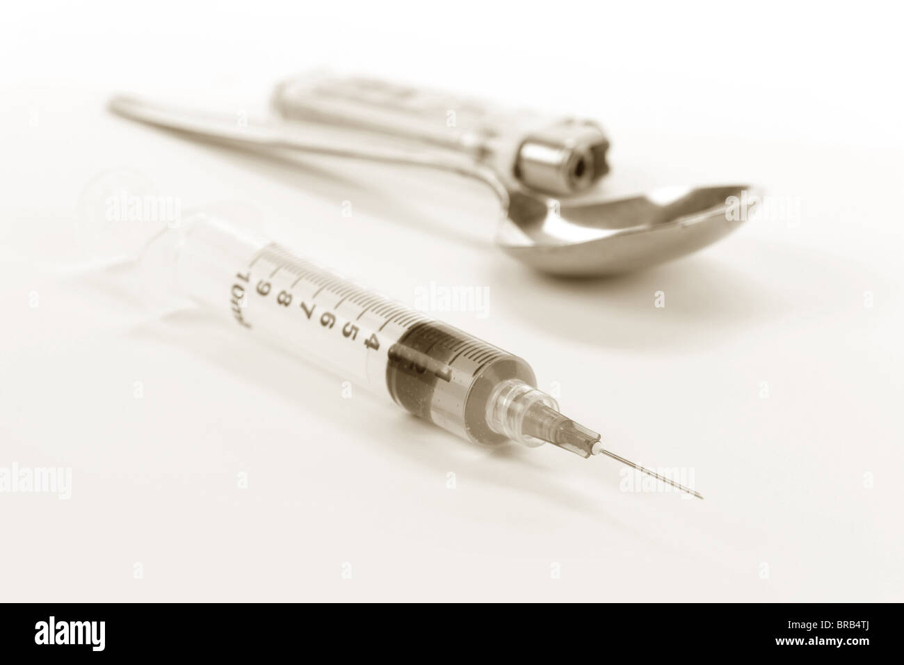 Syringe, spoon and lighter, concept of addiction Stock Photo - Alamy