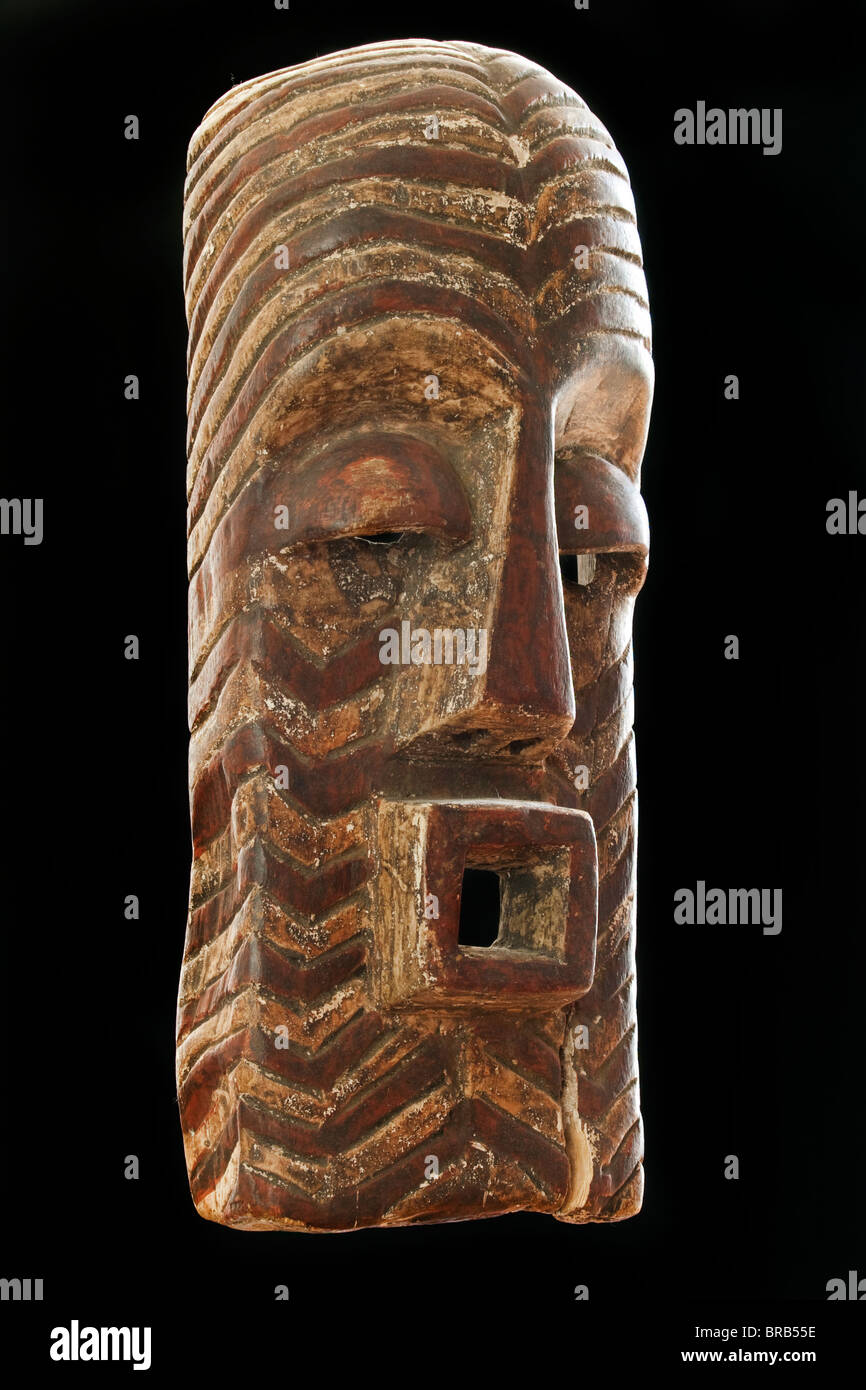 African carved shaman wooden mask against black background Stock Photo ...