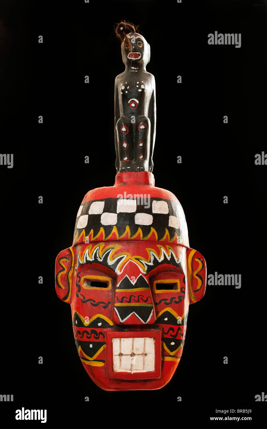 African carved shaman wooden mask against black background Stock Photo ...