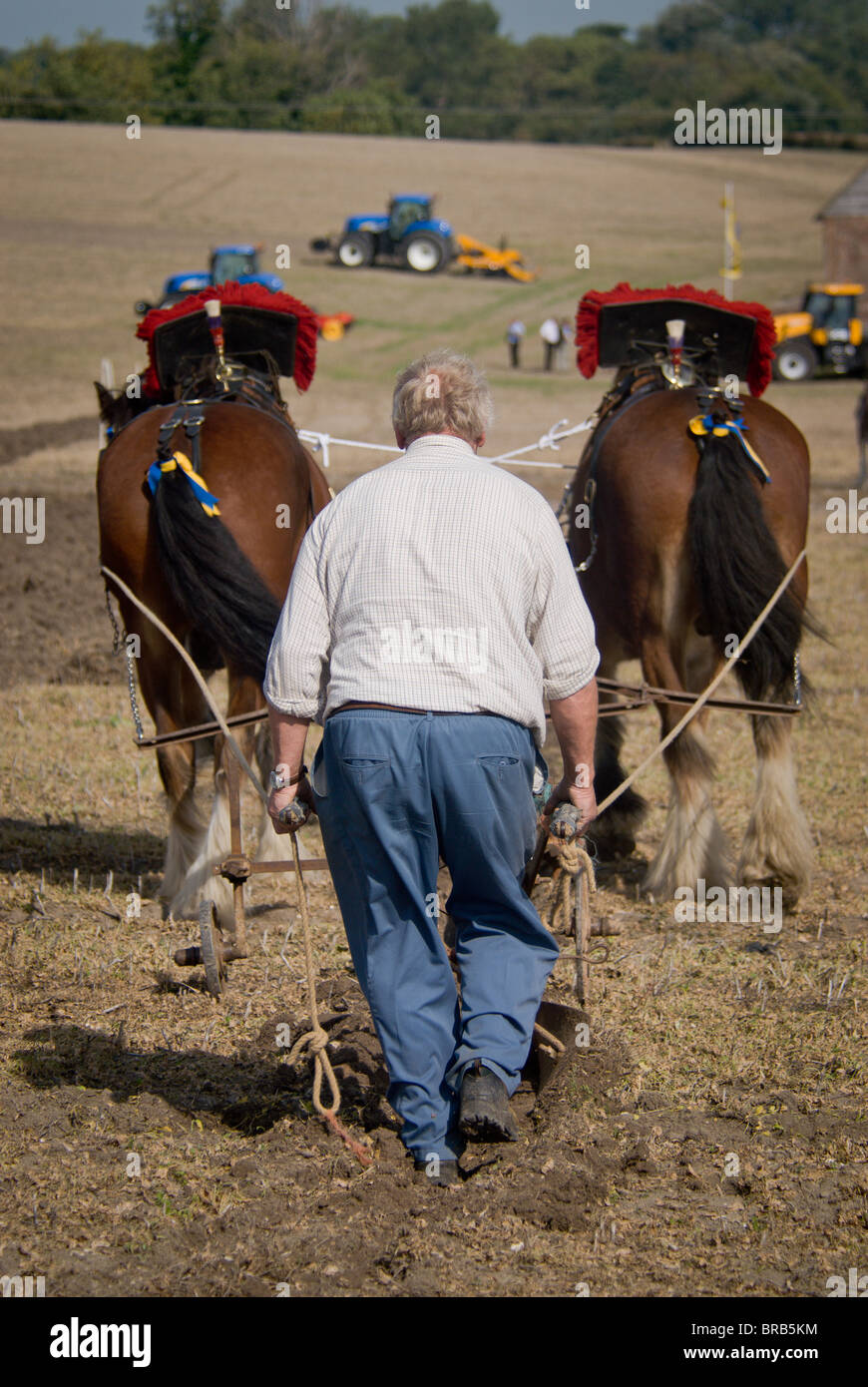 man ploughing field Stock Photo - Alamy