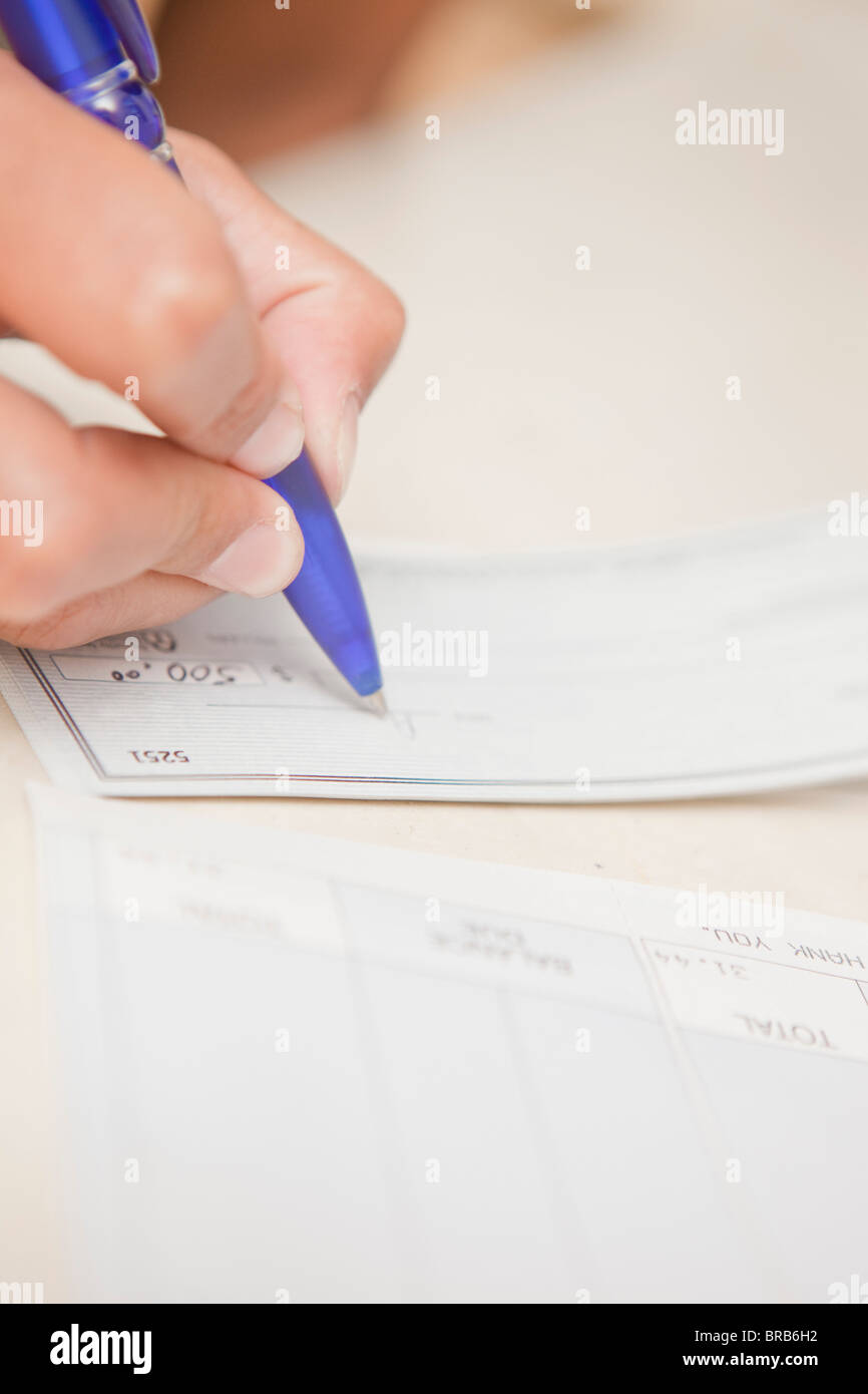 Female hand writing cheque hi-res stock photography and images - Alamy