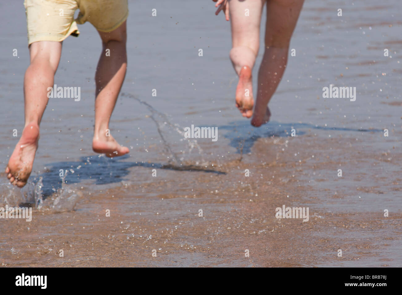 Running on the beach Stock Photo - Alamy