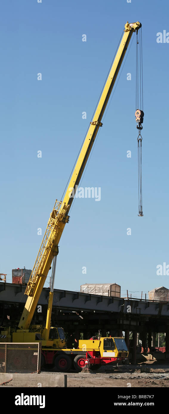 Mobile crane on the construction of bridge Stock Photo - Alamy