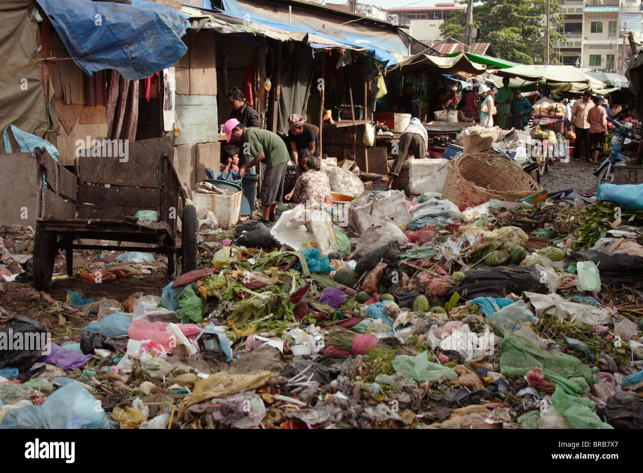 Rotting garbage is piled adjacent to squatter's homes in Phnom Penh ...